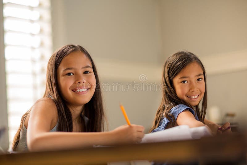 Young Girls Working on Their School Work Stock Image - Image of ...