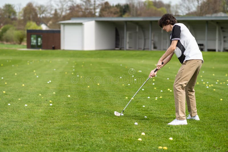 Young Golfer Playing Golf and Looking Involved Stock Image - Image of ...