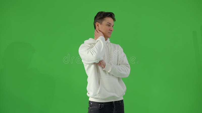 Handsome Young Man Smiles at the Camera in a Green Screen Studio Stock ...