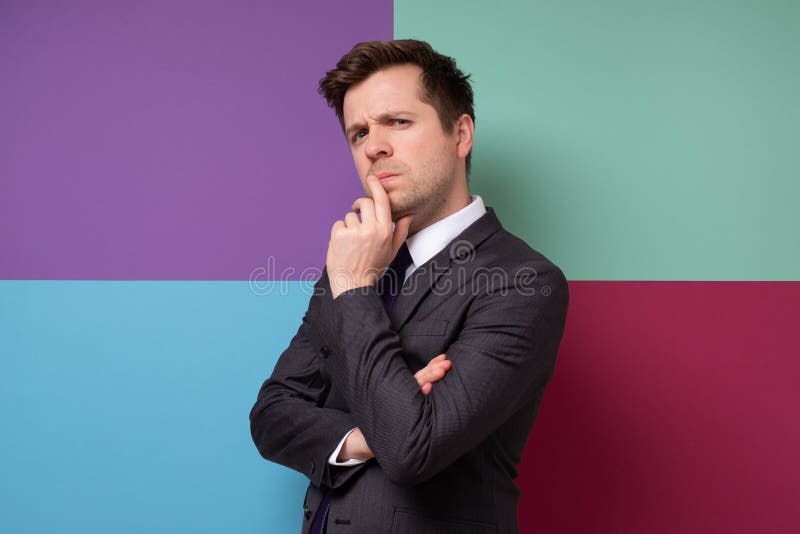 Young Good Looking Suited Man Thinking Trying To Make a Decision. Stock ...
