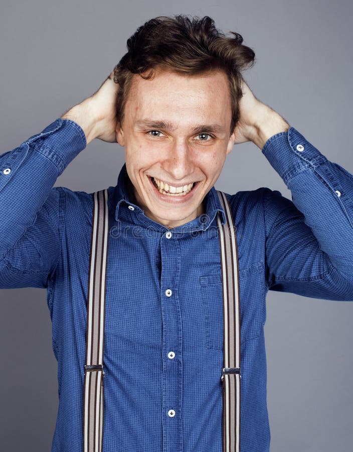 Young Goofy Man with Pimples Pointing in Studio Stock Photo - Image of ...