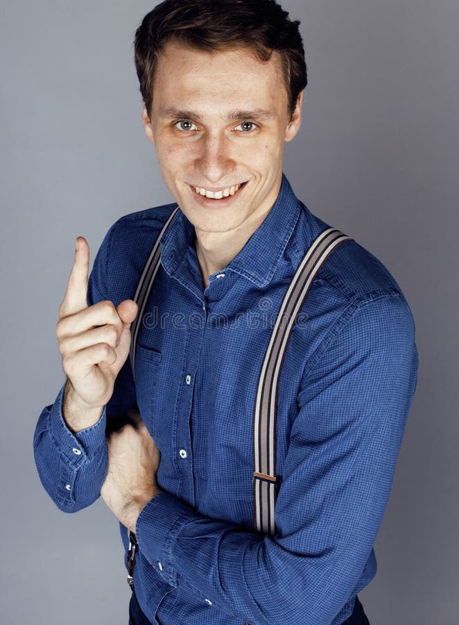 Young Goofy Man with Pimples Pointing in Studio Stock Photo - Image of ...