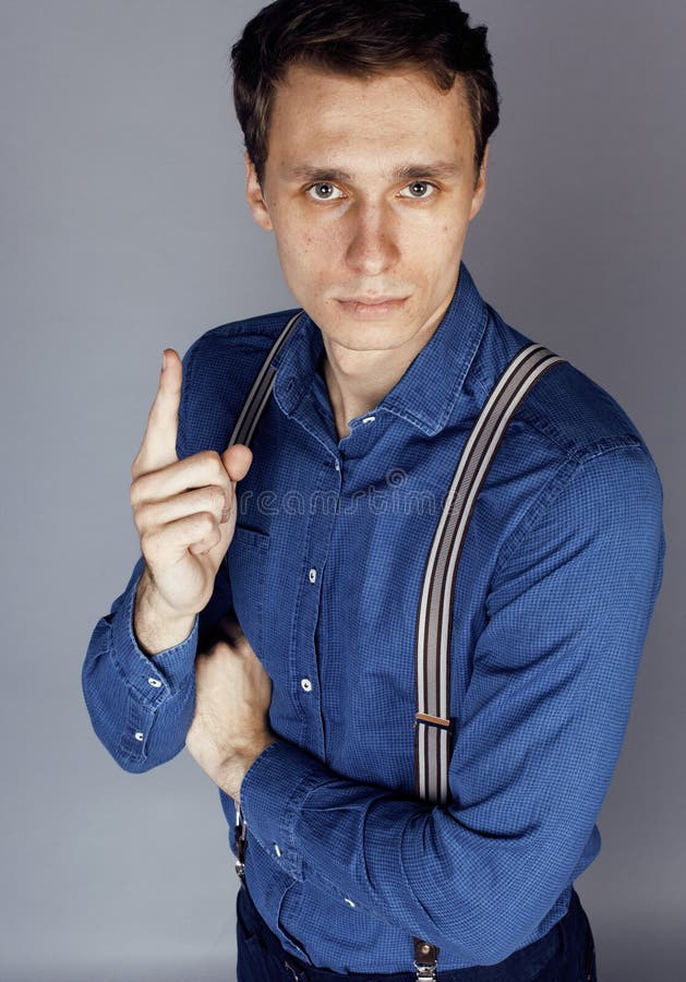 Young Goofy Man with Pimples Pointing in Studio Stock Image - Image of ...