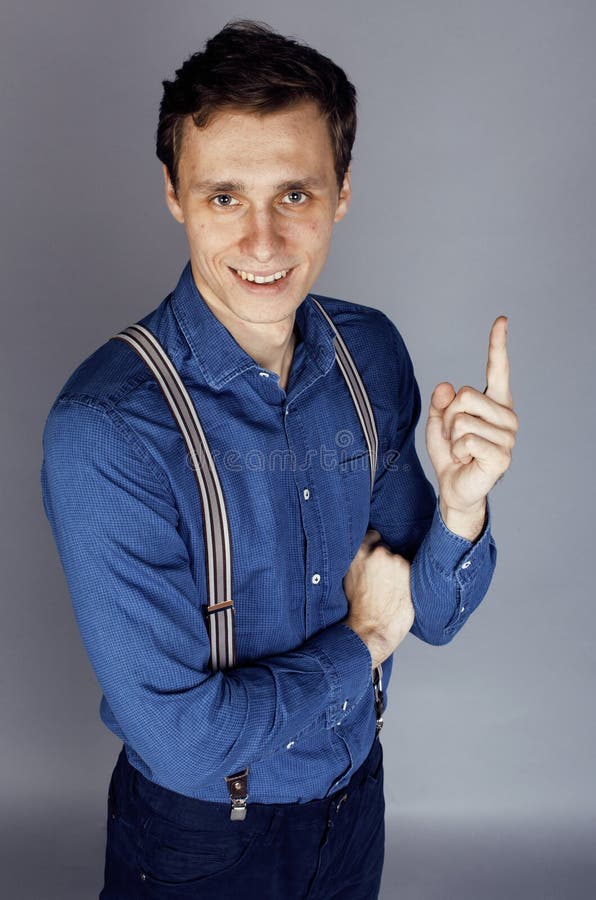 Young Goofy Man with Pimples Pointing in Studio Stock Photo - Image of ...