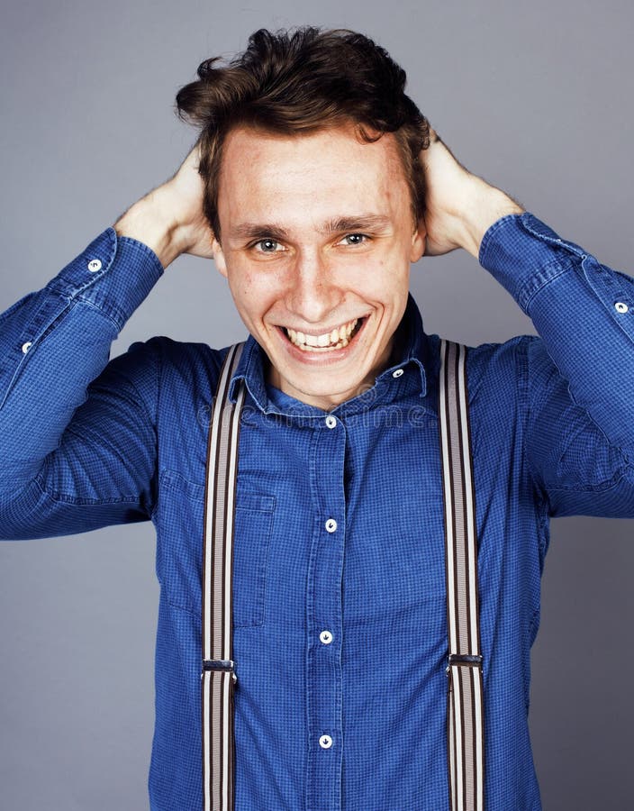 Young Goofy Man with Pimples Pointing in Studio Stock Photo - Image of ...