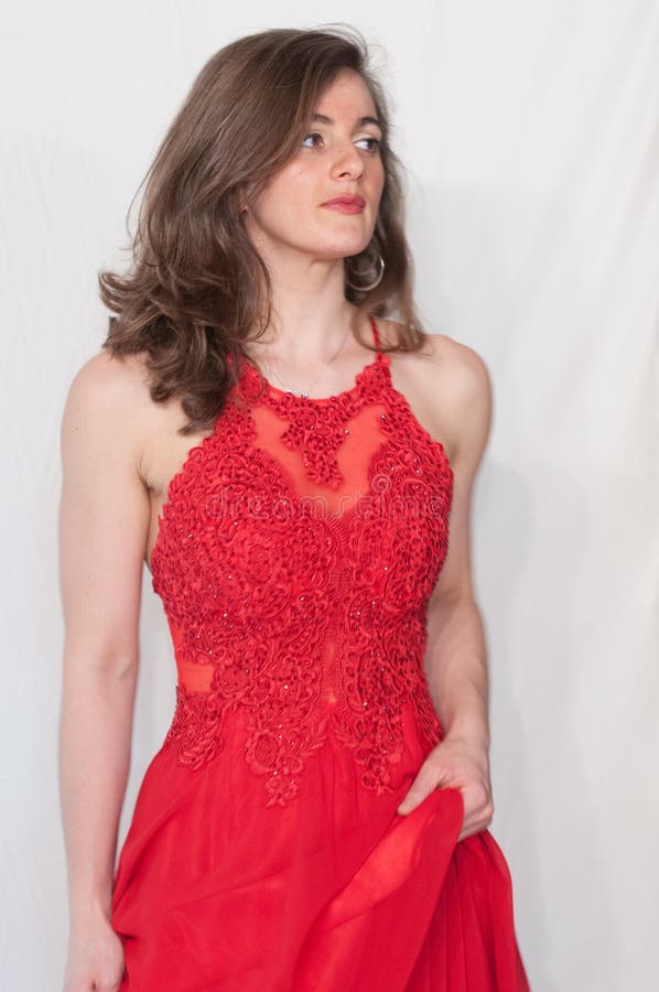 Young Gorgeous Model Dressed Red In A Wedding And Evening Style Sleeveless Dress In Red Lace