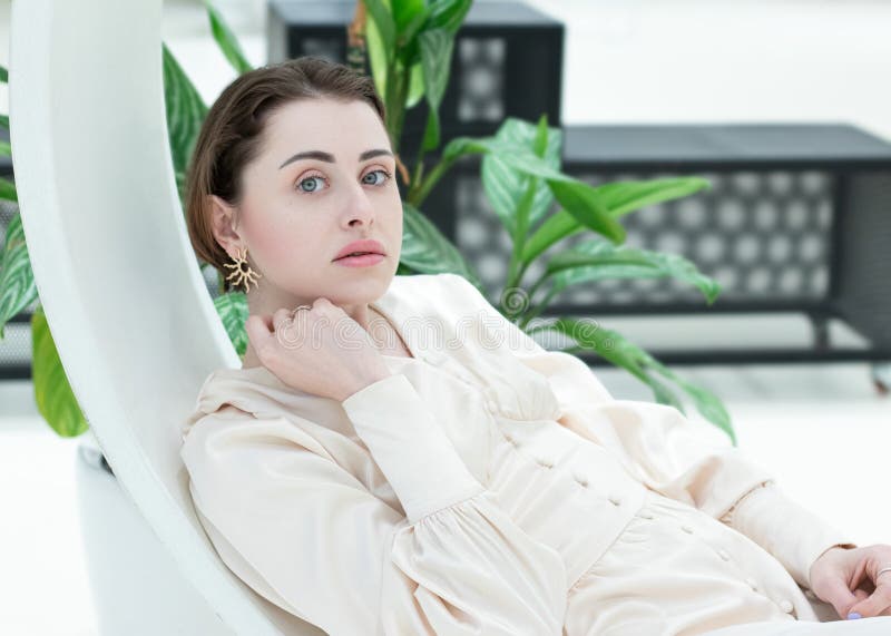 Young Graceful Woman Closeup On The Brick White Wall Stock Image