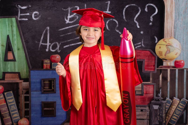 Young Graduate Boy in an Academic Cap and Gown, Holding a Large Scroll ...