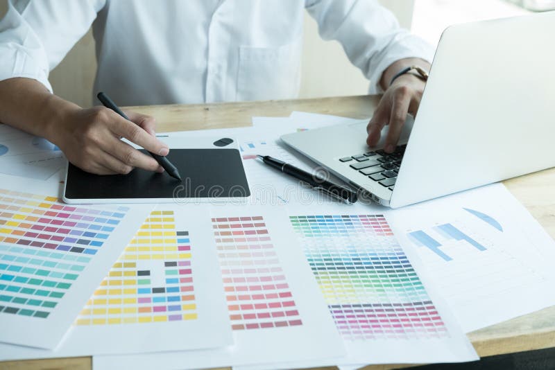 Young Graphic Designer Working with Computer and Color Swatch. C Stock ...