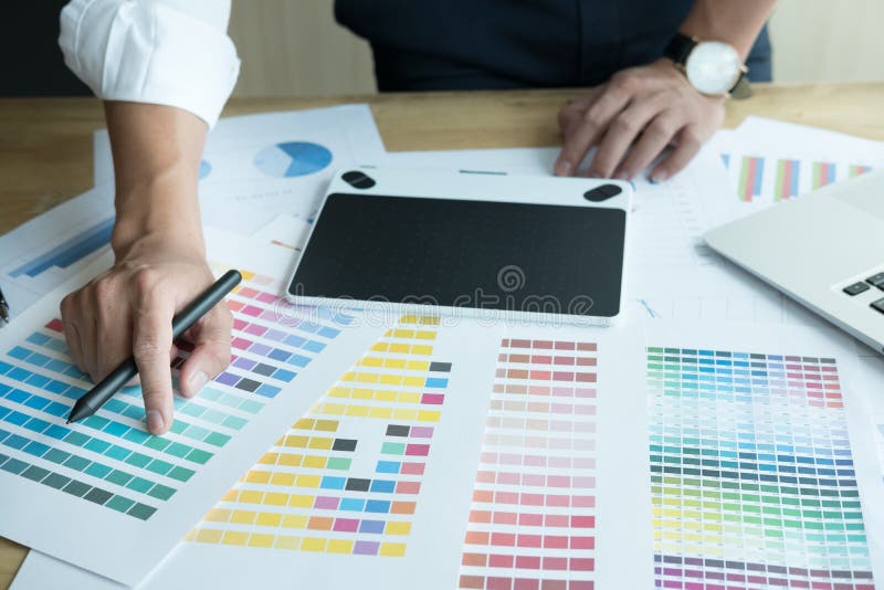 Young Graphic Designer Working with Computer and Color Swatch. C Stock ...