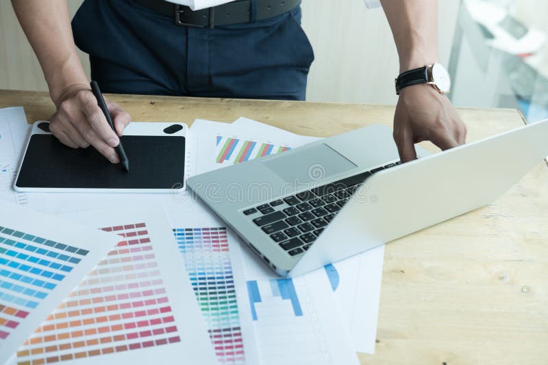 Young Graphic Designer Working with Computer and Color Swatch. C Stock ...