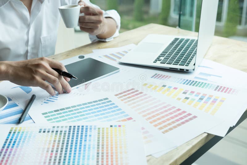 Young Graphic Designer Working with Computer and Color Swatch. C Stock ...