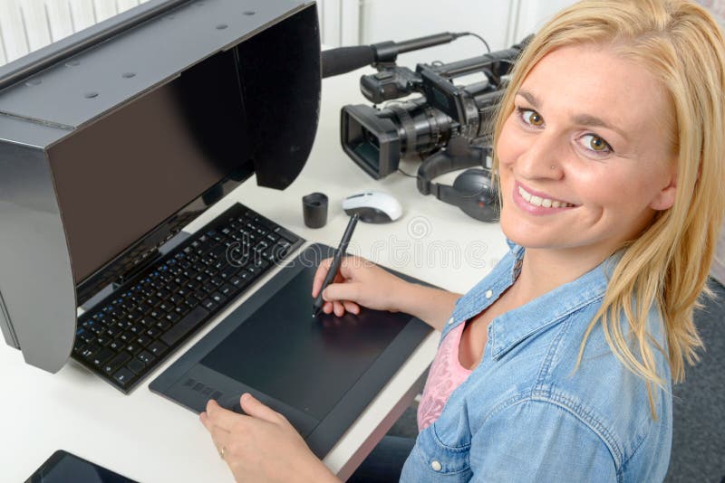 Young Graphic Designer Working on Computer Using Tablet Stock Image ...