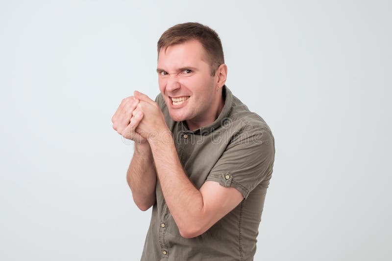 A Young Greedy Man Hides Something in His Hands Stock Image - Image of ...
