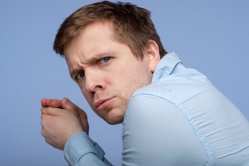 A Young Greedy Man Hides Something in His Hands Stock Photo - Image of ...