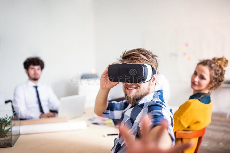 Young Group of Colleagues Using VR Technology in Startup Company Office ...