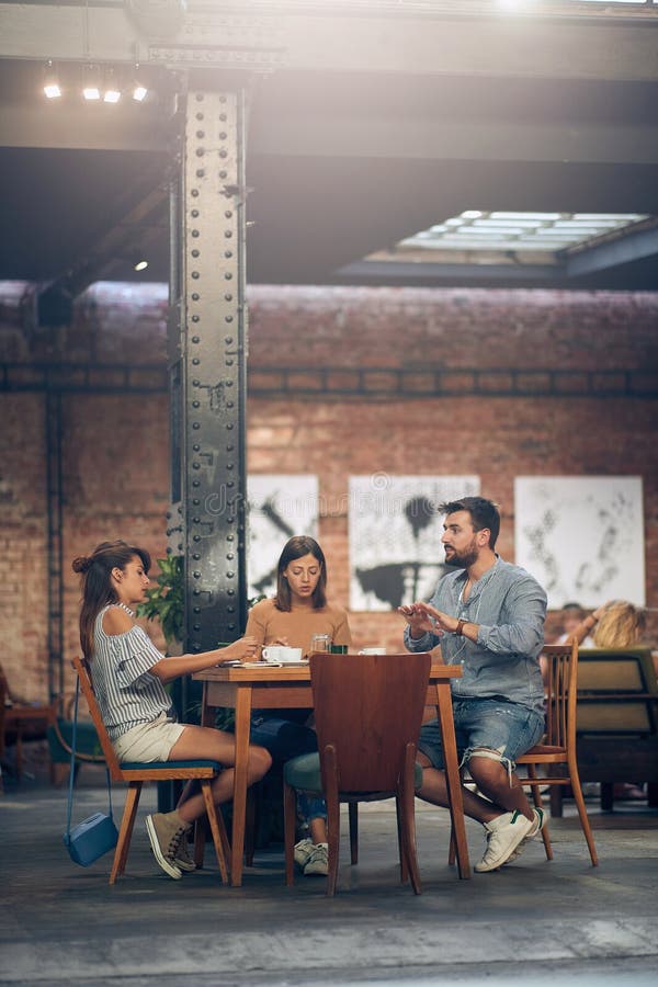 Young Group of Friends at Cafe, Having Coffee and Talking Stock Image ...