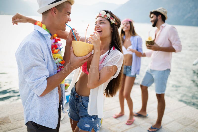 Young Group of Friends Enjoying Summer on the Beach at Sunset Stock ...