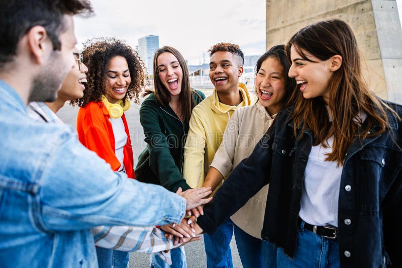 Young Group of Happy Diverse Friends Laughing while Walking Together ...