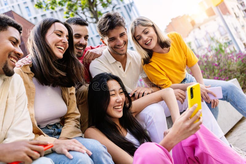 Young Group of Gen Z People Having Fun Using Cell Phone Together ...