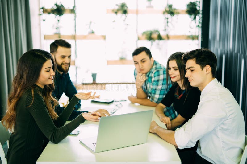 Young Group of People Discussing Business Plans. Stock Photo - Image of ...