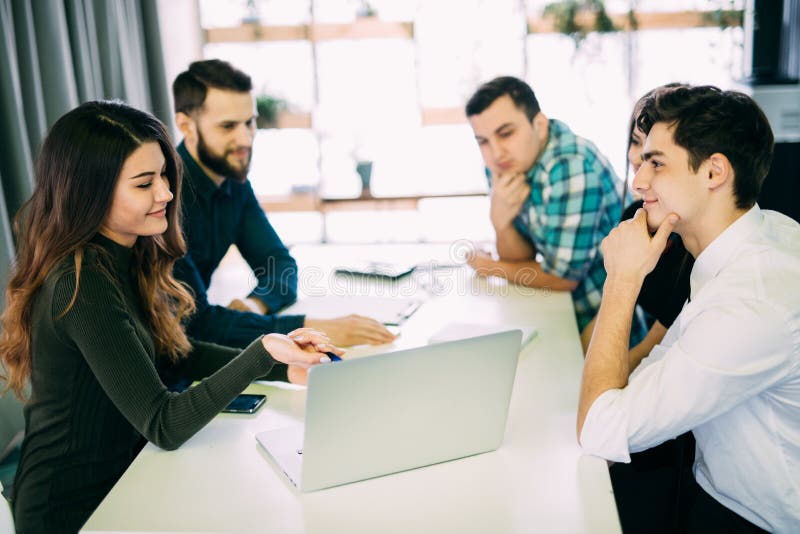 Young Group of People Discussing Business Plans. Stock Image - Image of ...