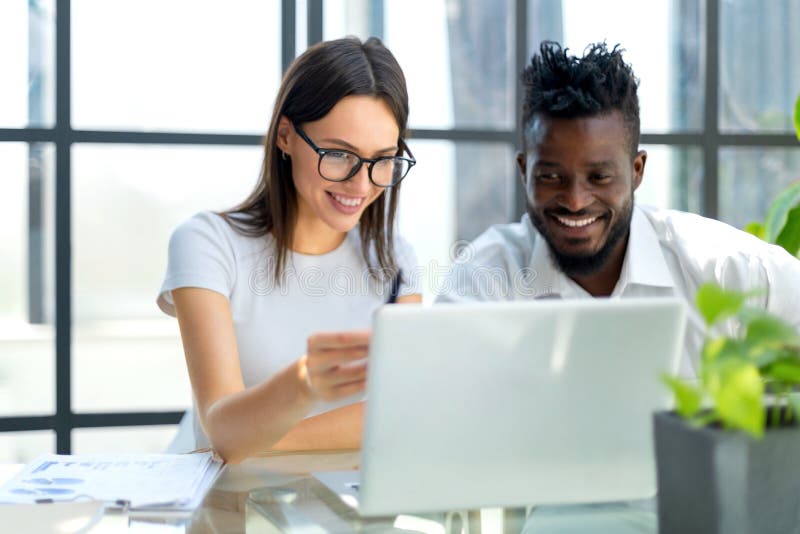 Young Group of People Doing Their Jobs on Laptop Stock Photo - Image of ... Young Group of People Doing Their Jobs on Laptop Stock Photo - Image of ...