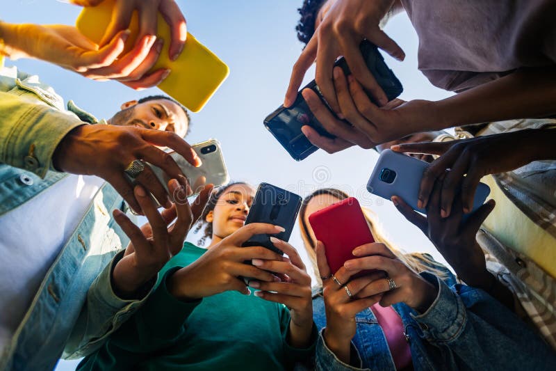 Young Group of People Using Mobile Phone Device Standing in Circle ...
