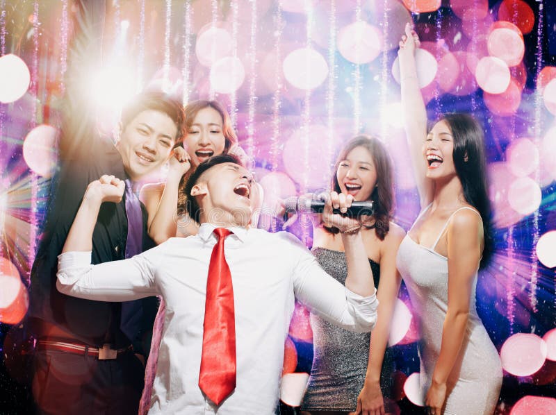 Young Group Singing and Dancing in Party Stock Photo - Image of group ...