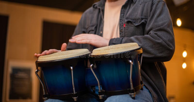 A Young Guy with a Beard Plays Percussion Bongos Stock Photo - Image of ...