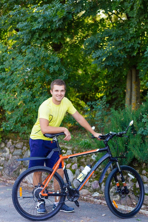 A Young Guy on a Bike Outdoors Stock Photo - Image of lifestyle, shape ...