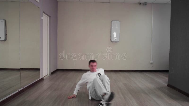 Down View of Young Guy Breakdancer Dances Hip Hop on Floor in Studio ...