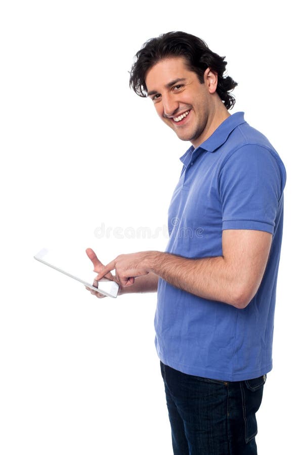 Young Guy Browsing on Tablet Device Stock Photo - Image of internet ...