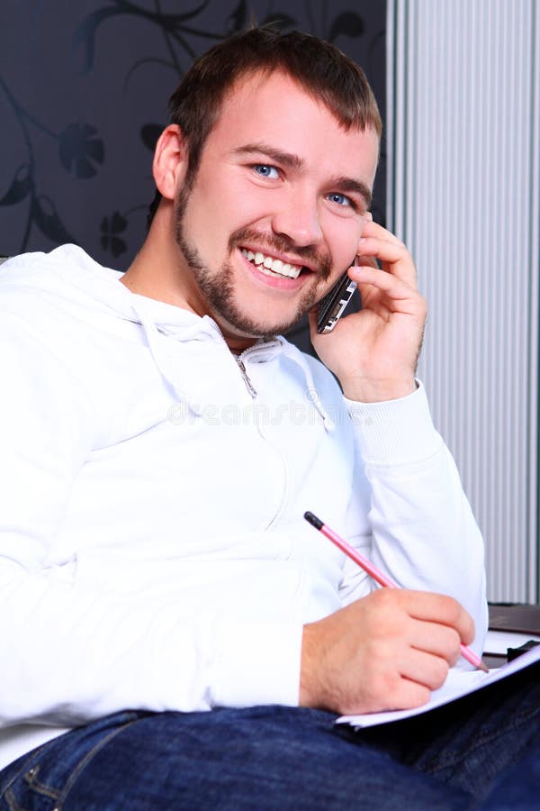 Happy Young Man Talking on Mobile Phone Stock Photo - Image of holding ...