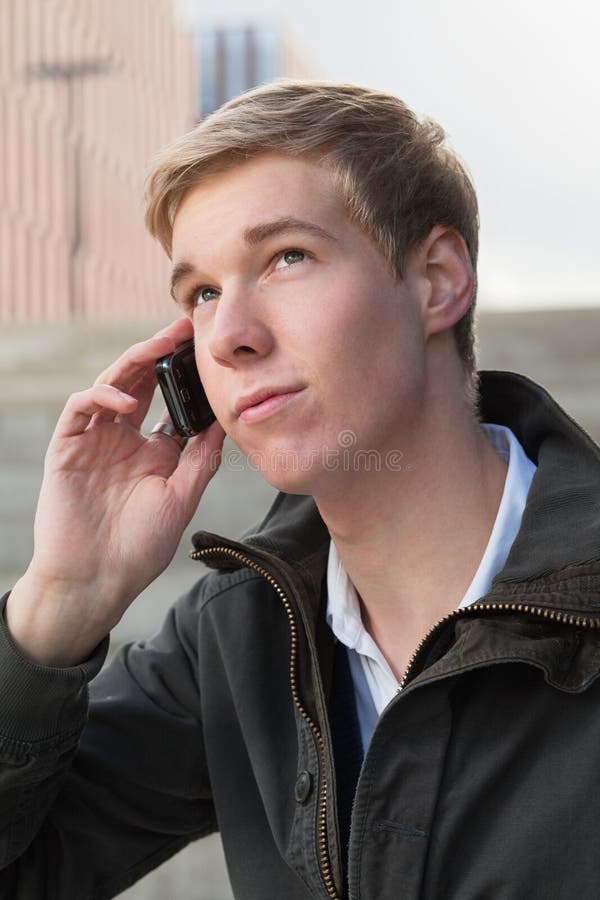 Young guy with cellphone stock photo. Image of vertical - 11954908