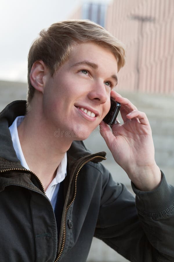 Young guy with cellphone stock image. Image of cheerful - 11955035
