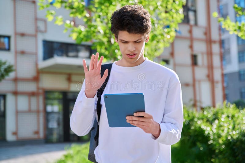 Portrait of Handsome Young Male Student with Laptop in Educational ...