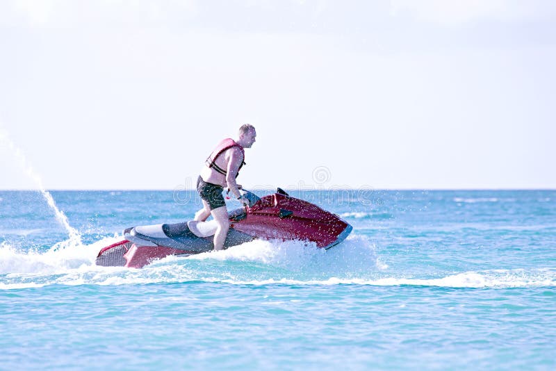 Young Guy Cruising on a Jet Ski Stock Image - Image of speed, horizon ...