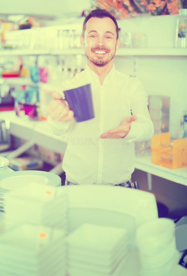 Young Guy Deciding on Practical Cup Stock Photo - Image of decor, blue ...