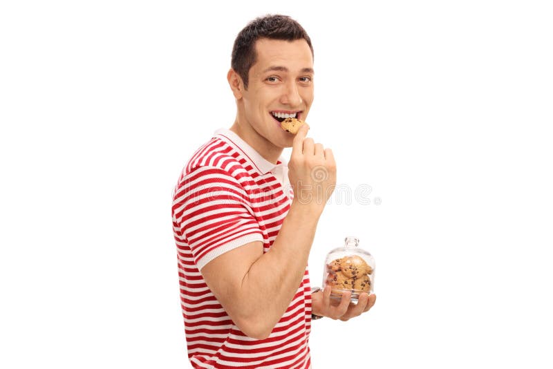 Young guy with cookie stock photo. Image of expression - 33954860
