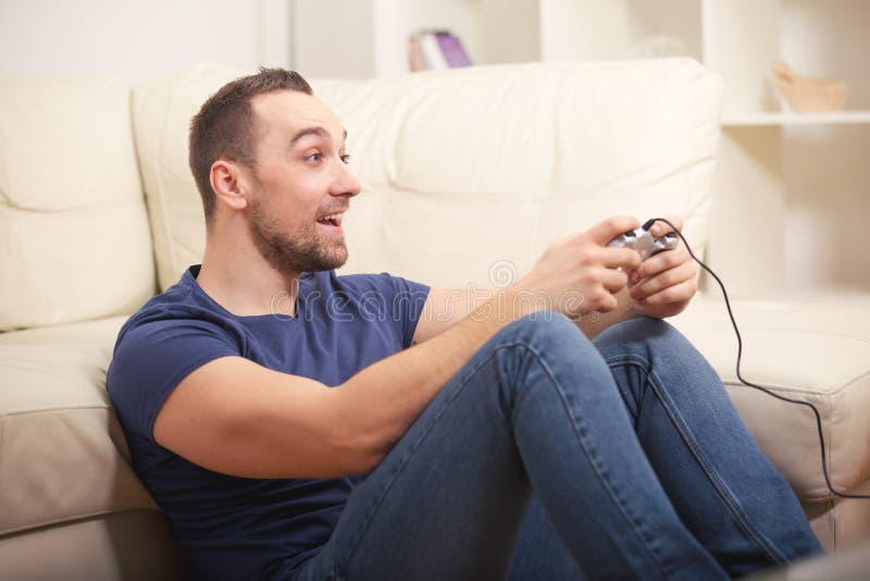 Young Guy Enjoying Computer Game, Playing with Joystick Stock Image ...