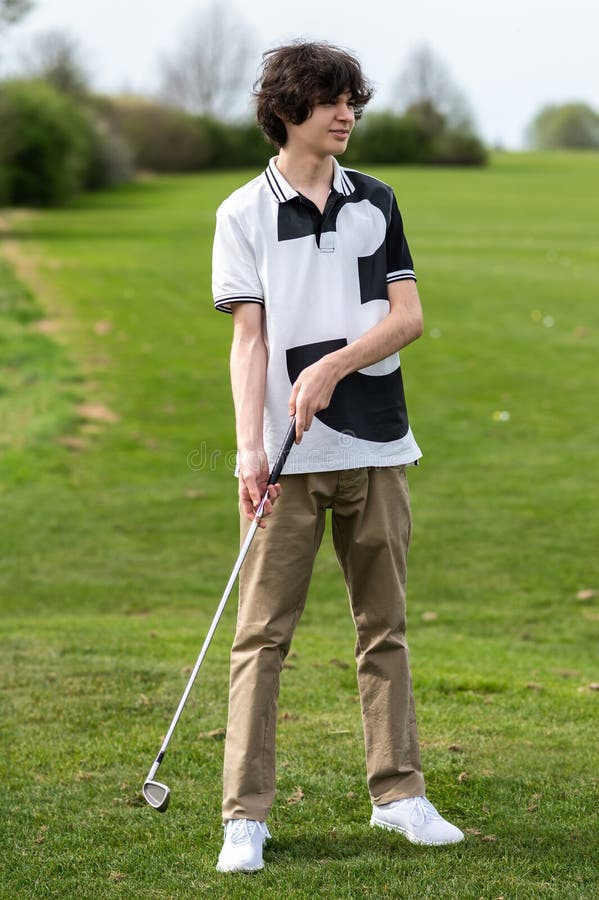 Young Guy on a Filed with a Golf Stick Stock Photo - Image of equipment ...