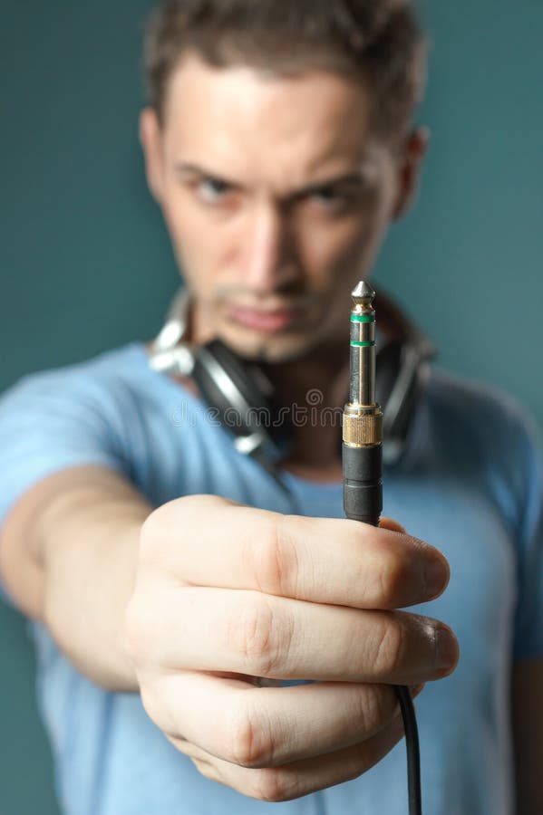 Young Guy Holding Stereo Jack Plug Stock Photo - Image of audio, detail ...
