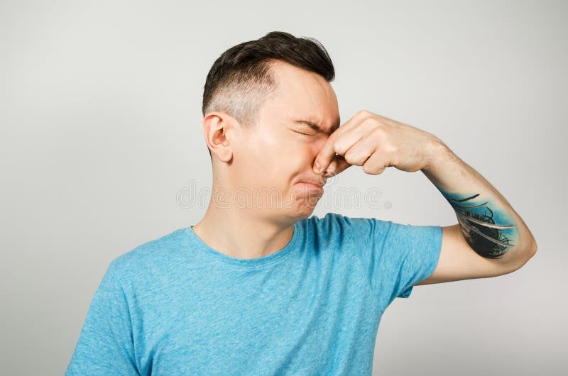 Young Man Inserts Two Fingers in the Mouth To Induce Vomiting Stock ...
