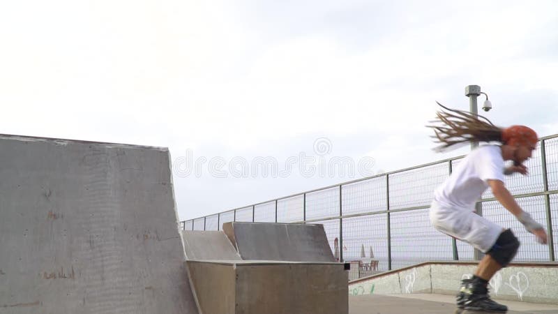 A Young Guy Jumps Over a Ramp Performing a Trick, Slow Motion Stock ...
