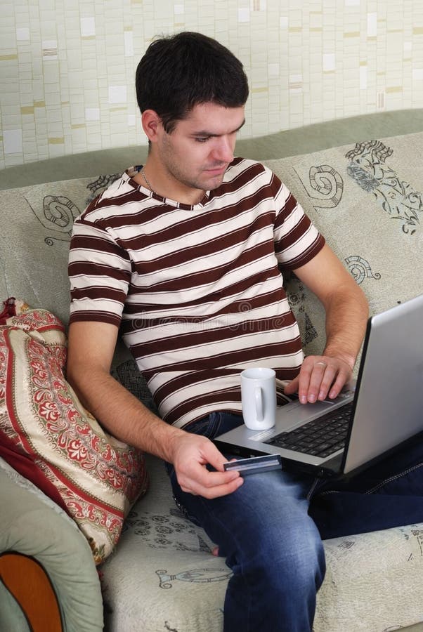 Young guy with a laptop stock image. Image of glance - 22698285