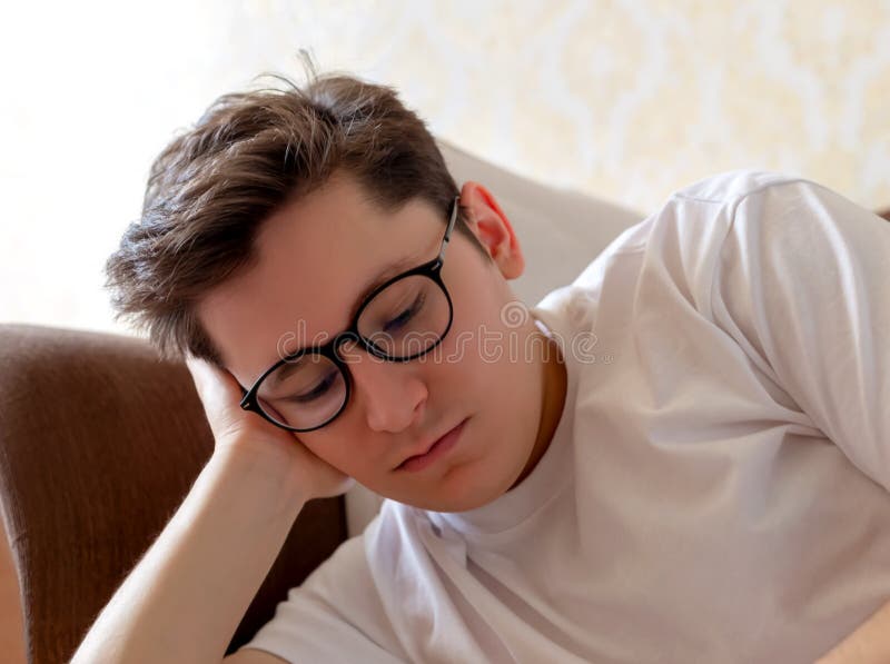 A Young Guy Lying Down Reading Stock Photo - Image of modern, home ...