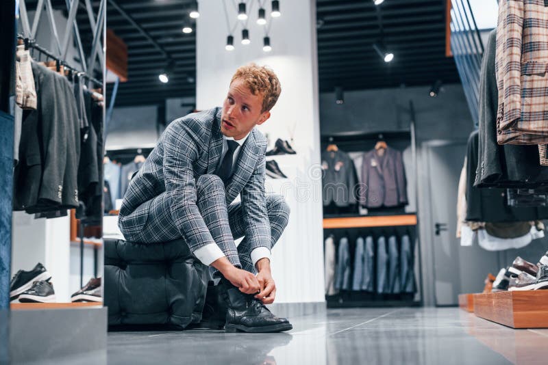 Young Guy in Modern Store with New Clothes. Elegant Expensive Wear for ...