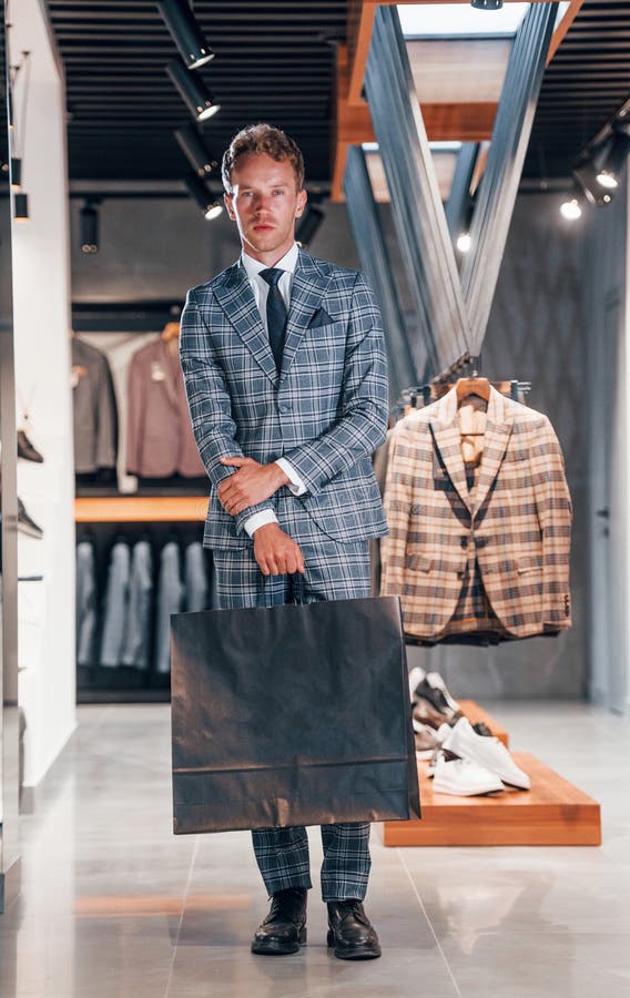 Young Guy in Modern Store with New Clothes. Elegant Expensive Wear for ...