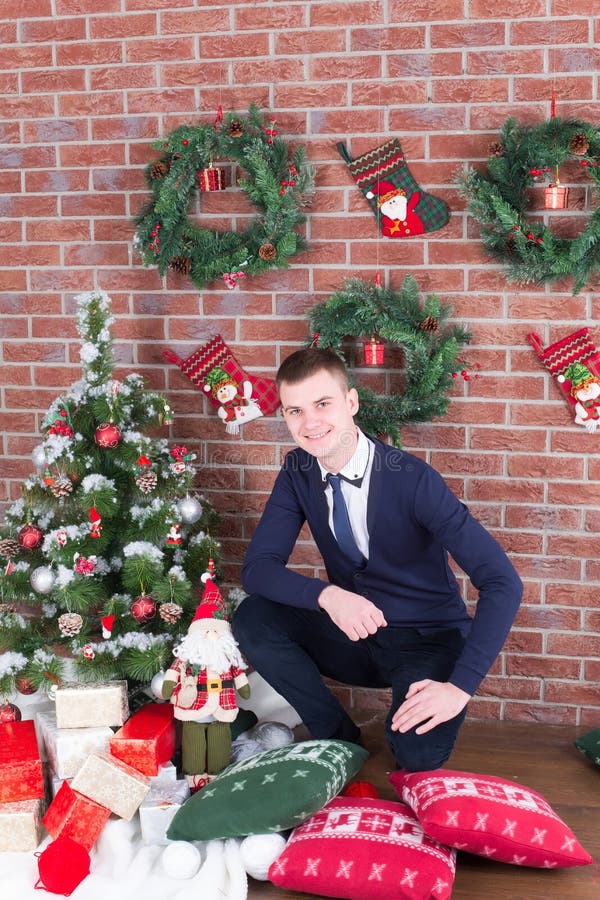 Young Guy Next To a Christmas Tree Stock Image - Image of people ...